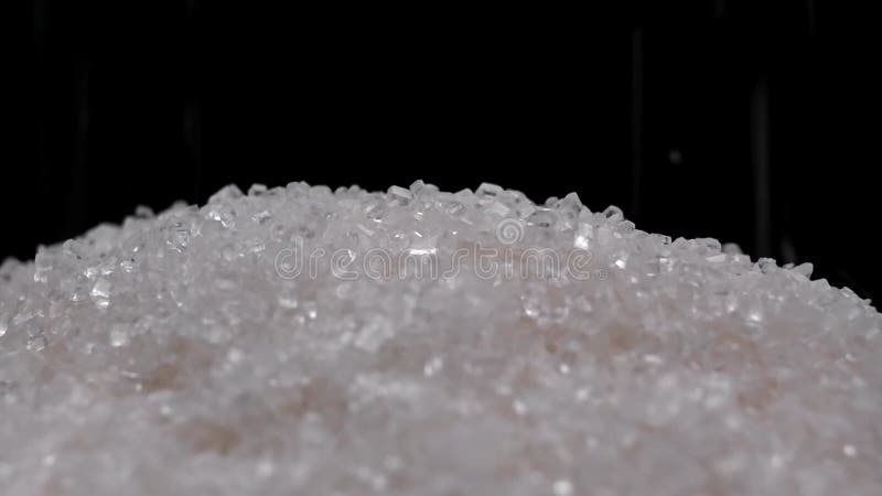 Falling Grains of White Sugar into the Total Mass of Sugar. Stock ...