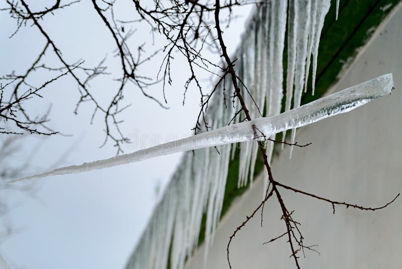 Falling Icicles from the Roof Stock Image - Image of eaves, cold: 109687731