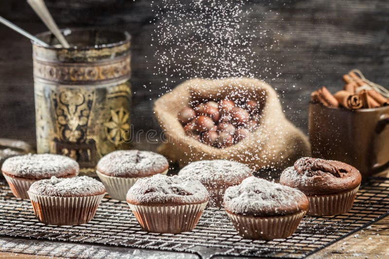 Falling Icing Sugar on Fresh Chocolate Muffins Stock Photo - Image of ...