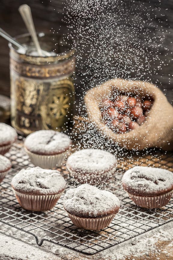 Falling Icing Sugar on Fresh Chocolate Muffins Stock Image - Image of ...