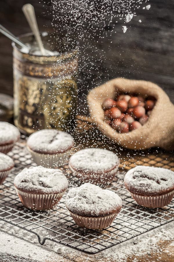 Falling Icing Sugar on Fresh Chocolate Muffins Stock Image - Image of ...