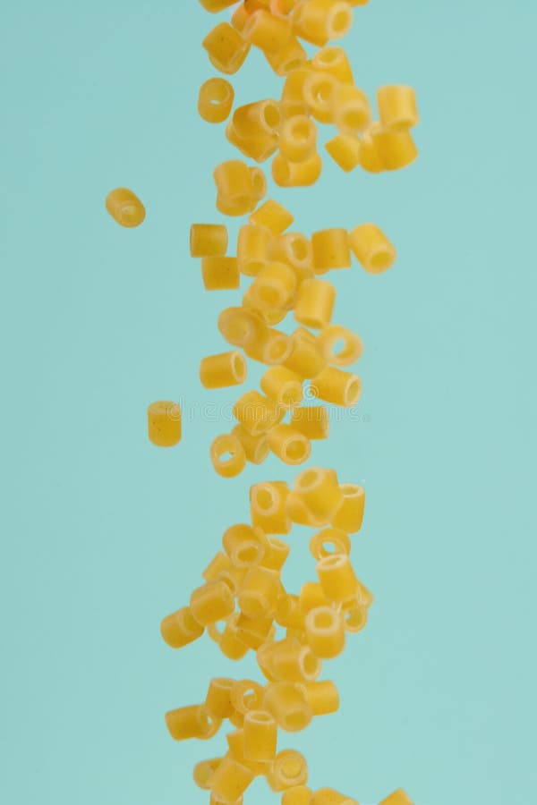 Falling Italian Pasta on a Light Blue Background, Freezing in Motion ...