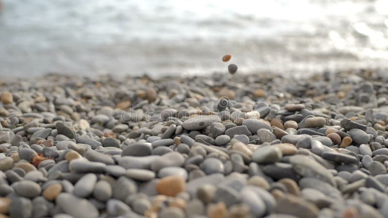 Falling Pebbles on the Background of the Sea Stock Video - Video of ...