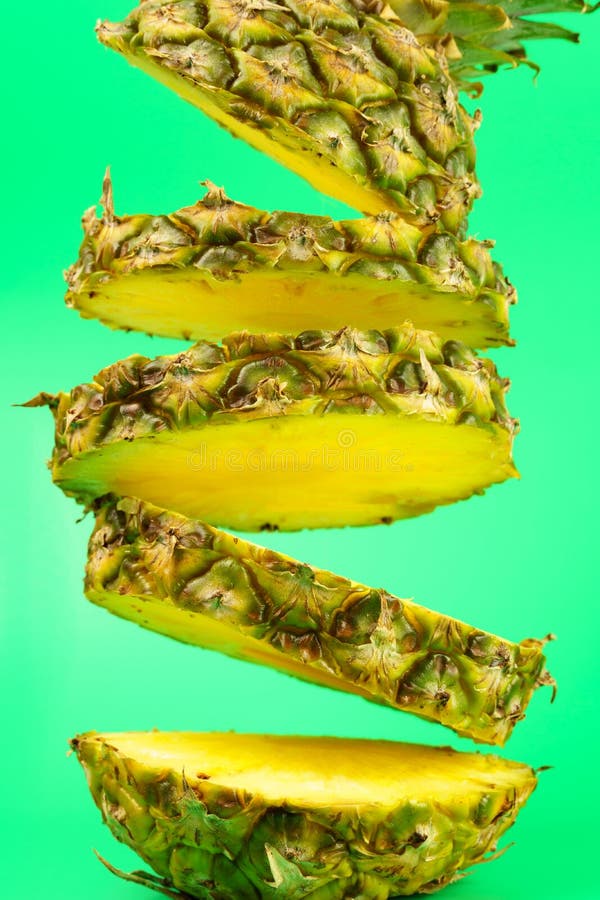 Falling Pineapple Rings on a Green Background Stock Image - Image of ...
