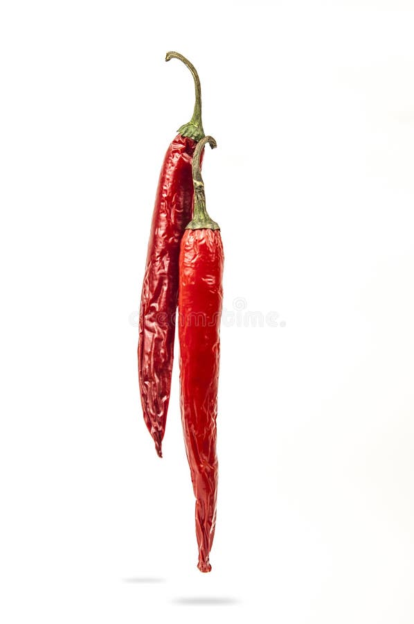 Falling Red Chili or Chilli Pepper on White Background Stock Image ...