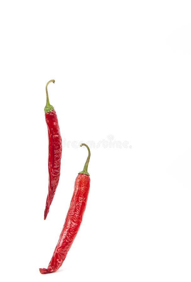 Falling Two Red Chili or Chilli Pepper on White Background Stock Image ...