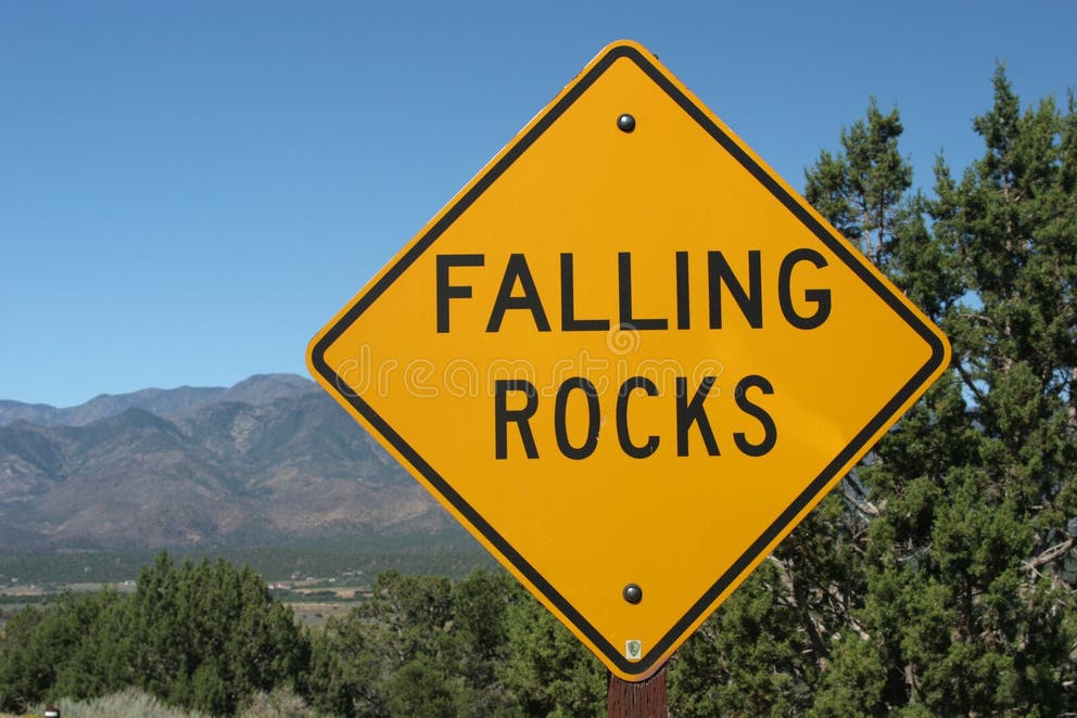 Falling Rocks Ahead Road Sign Stock Photo - Image of caution, nature ...