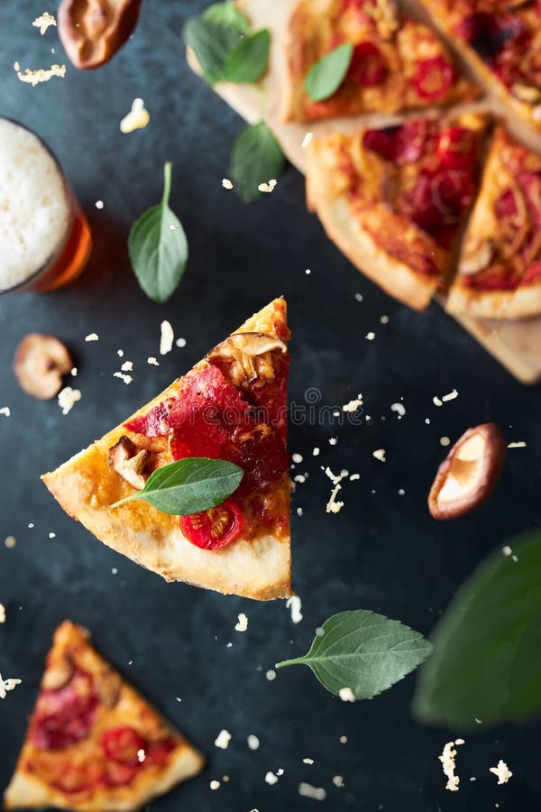 Falling Slice of Pizza and Ingredients from Top View Stock Photo ...