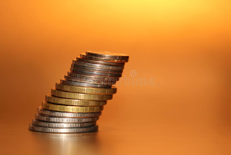 Falling Stack of Coins on a Golden Background Stock Image - Image of ...