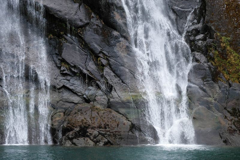 Falling Water and Mossy Stone Face in Endicott Arm, Alaska, USA Stock ...