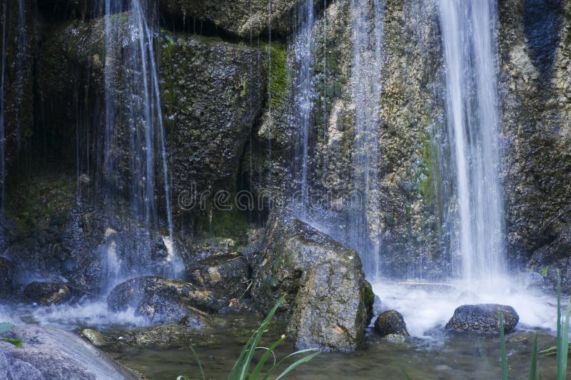 Falling water on stones stock photo. Image of outside - 43536356