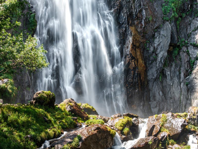 Falling Water in a Waterfall Creates a Cloud of Water Dust Stock Image ...