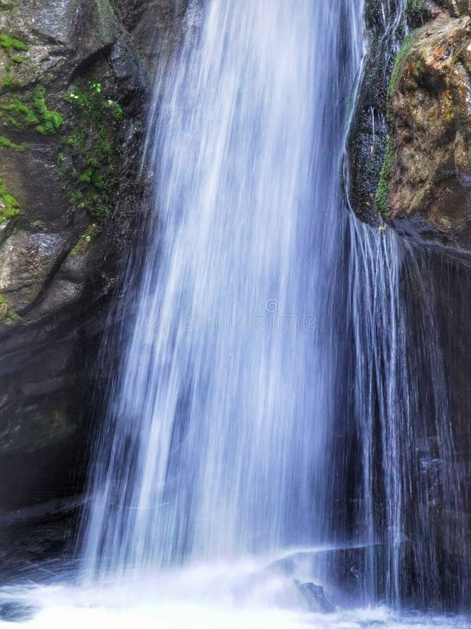 Falling Water from the Waterfall with Rocks Around Stock Photo - Image ...