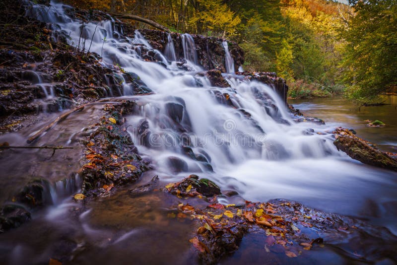 Falling Waterfall Surrounded by Autumn Trees Stock Image - Image of ...
