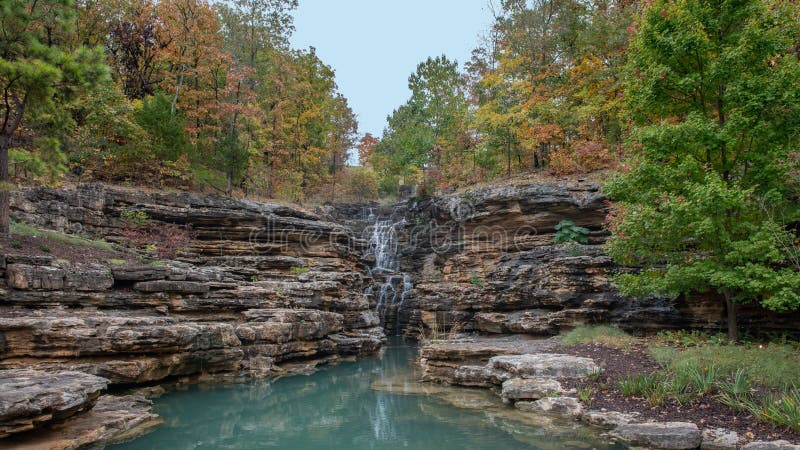 Falling Waterfall Surrounded by Dense Trees Stock Image - Image of ...