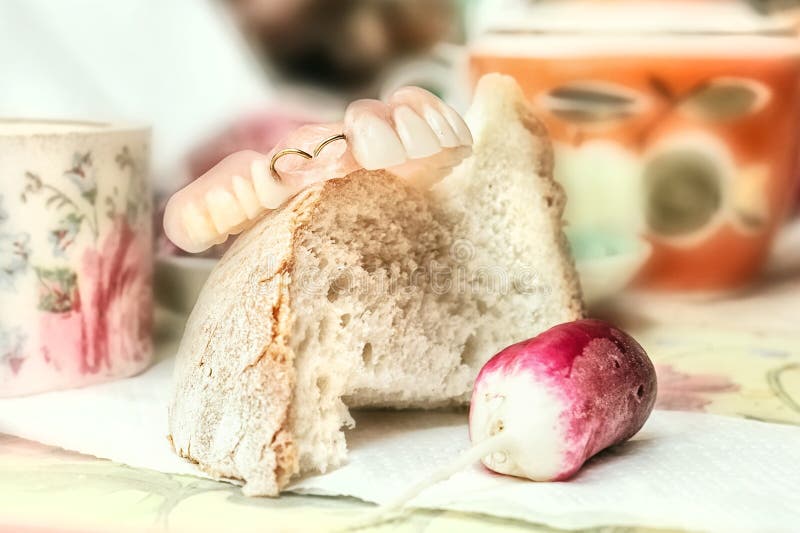 False teeth with bread stock photo. Image of dentist - 74910974