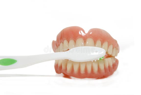 False teeth and toothbrush stock image. Image of path - 7889643
