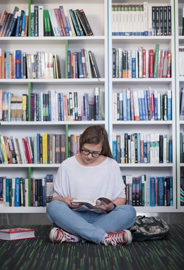 Famale Student Reading Book in Library Stock Image - Image of modern ...