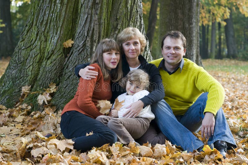 Family in autumn park stock image. Image of cute, daughter - 6712149