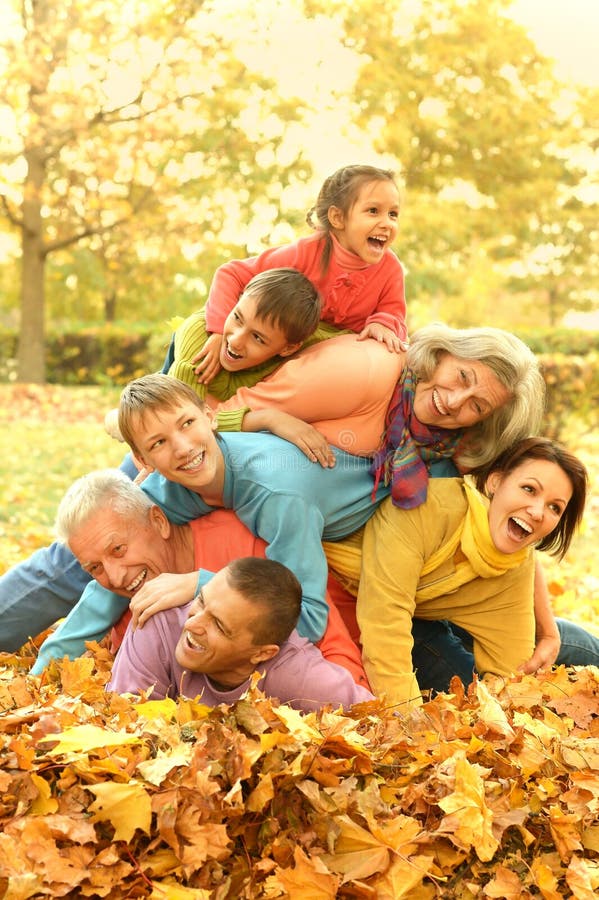 Family in autumn park stock photo. Image of kids, group - 46591288