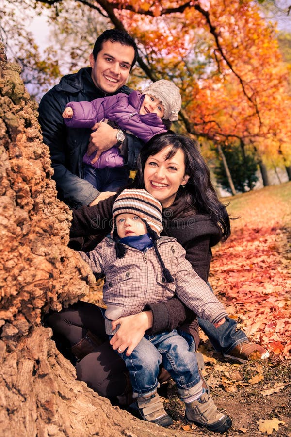 Family in the autumn park stock image. Image of women - 30819923