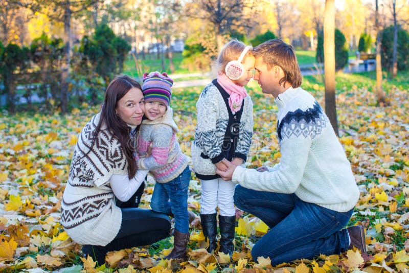 Family in the Autumn Park Relaxing and Having Fun Stock Photo - Image ...