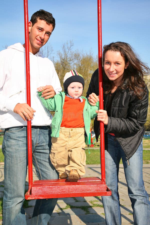 Family on seesaw stock image. Image of smiling, seesaw - 1870153