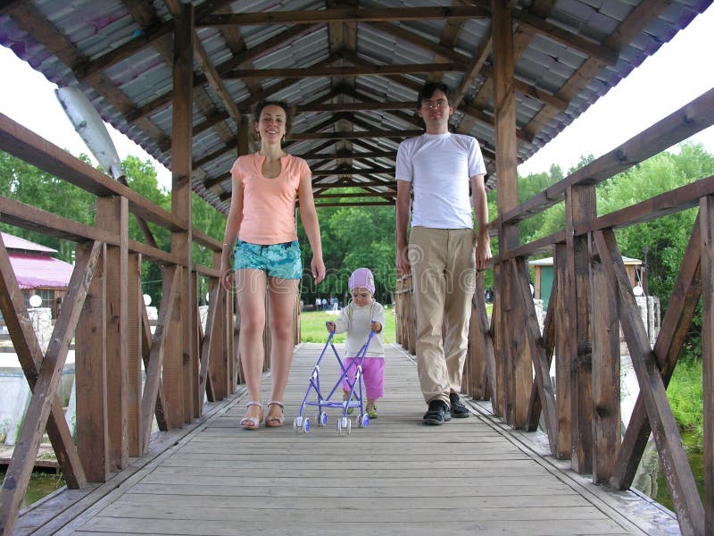 Family with baby on bridge stock image. Image of bridge - 1014657