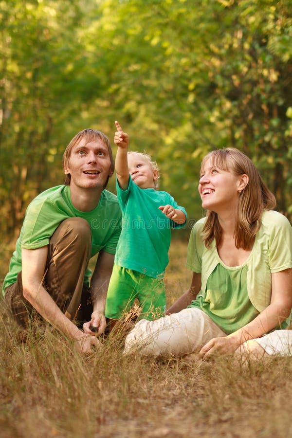 Family with Baby Pointing Up Stock Photo - Image of cute, couple: 20544402