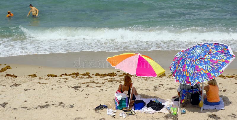 Family Beach Day stock photo. Image of umbrellas, secluded - 524414