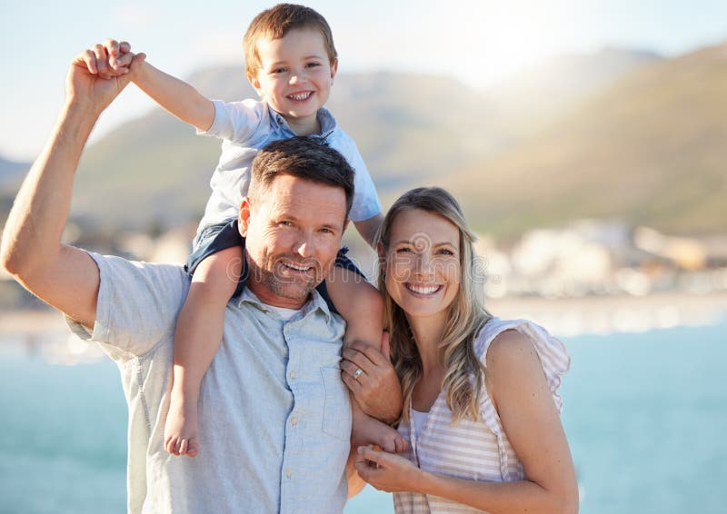 A Family Beach Day. a Young Family Spending a Day at the Beach. Stock ...
