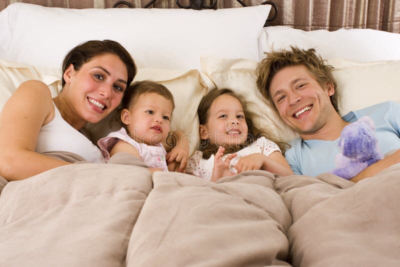 Family bed stock photo. Image of kids, people, morning - 10656776