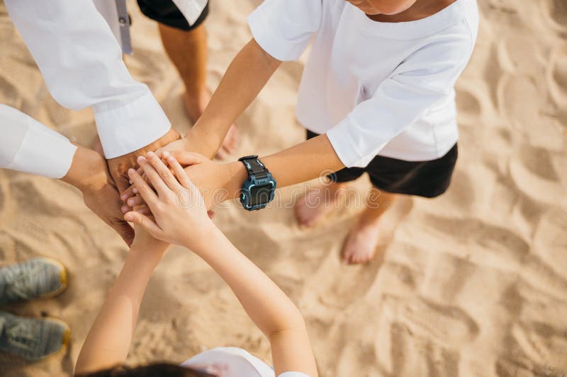 Family Bonding at the Beach. Hands Together in a Teamwork Stack ...