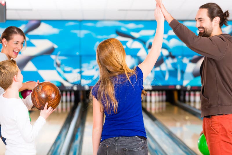 Family at Bowling Center stock image. Image of active - 41663271