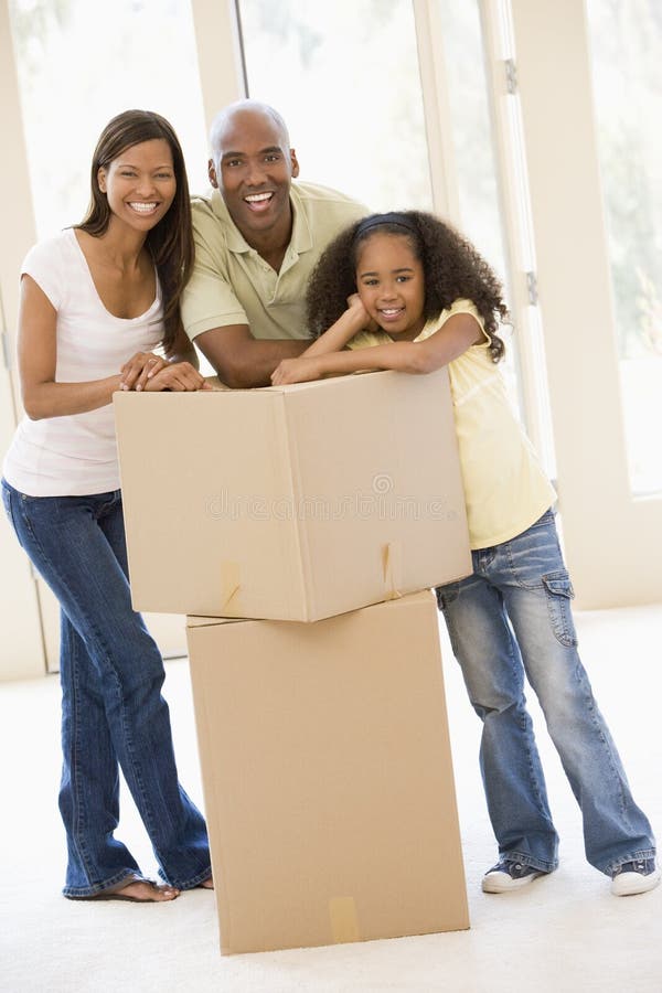 Family with Boxes in New Home Smiling Stock Image - Image of moving ...