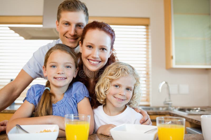 Family with Breakfast Behind the Kitchen Counter Stock Image - Image of ...