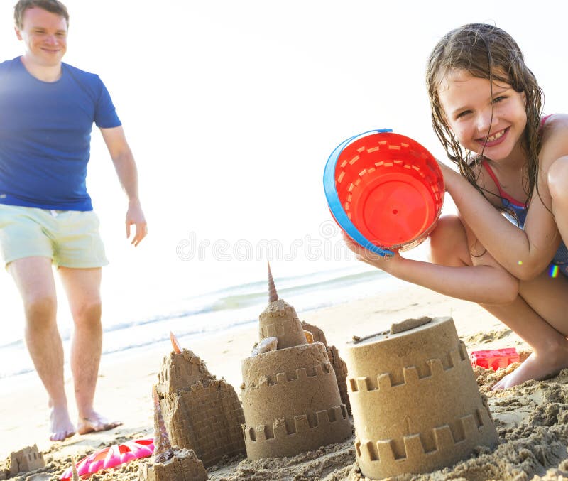 Family Building a Sand Castle Stock Image - Image of leisure ...