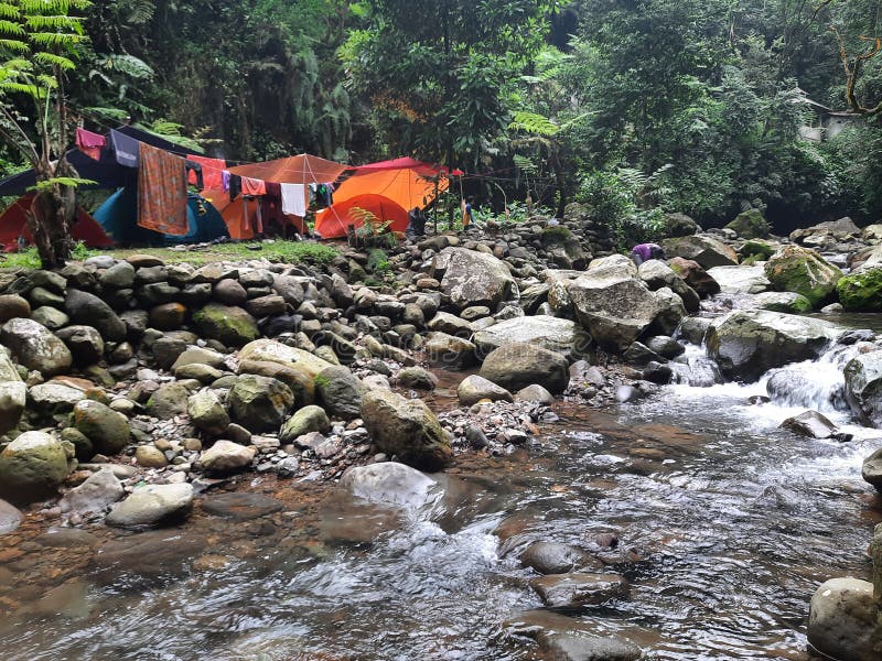 Family Camping in a Clear and Rocky Waterfall Stock Photo - Image of ...