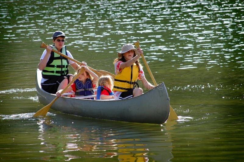 Family Canoeing at Lake stock image. Image of canoe, black - 14385097