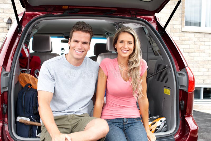 Young Family Pose Together at Rear of Car Stock Image - Image of ...