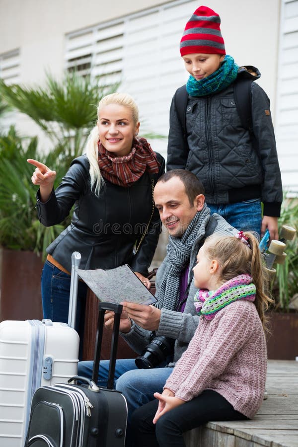 Family Checking Direction in Map Stock Image - Image of parents, bags ...
