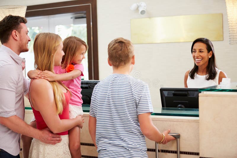 Family Checking in at Hotel Reception Stock Photo - Image of tourist ...