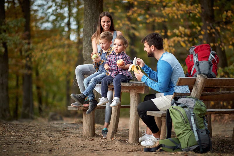 Family with Children Having Fruit Snack on Outing Stock Image - Image ...