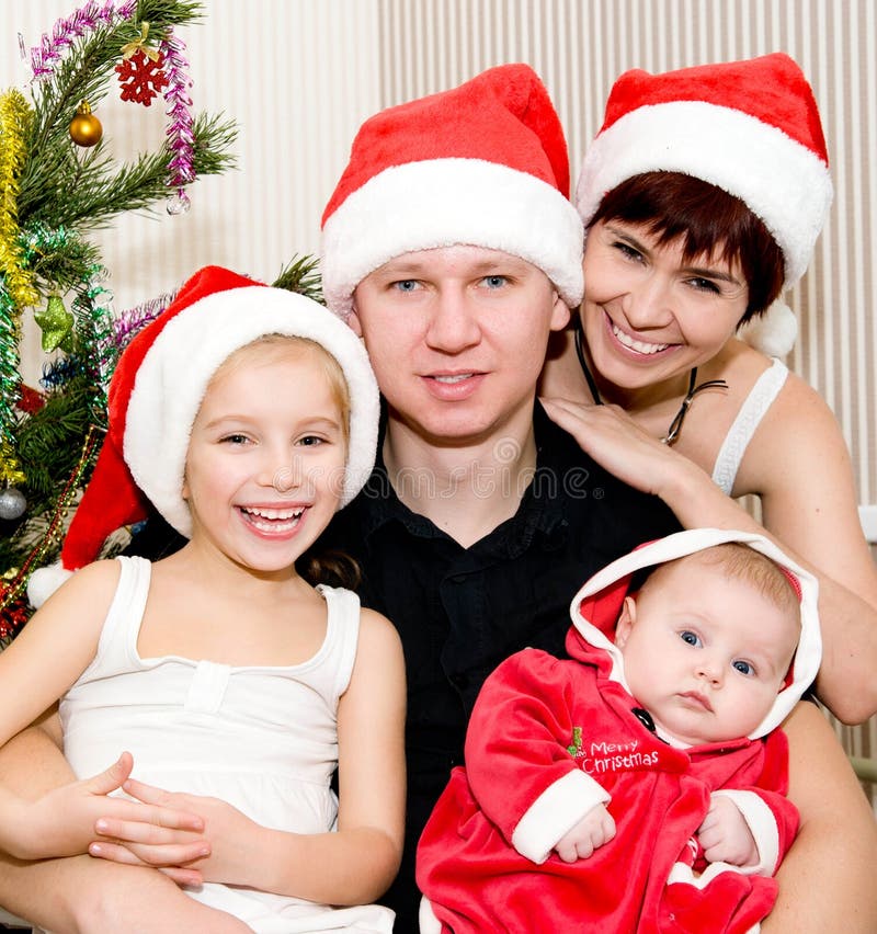 Family and a Christmas Tree Stock Image - Image of toys, green: 34532229