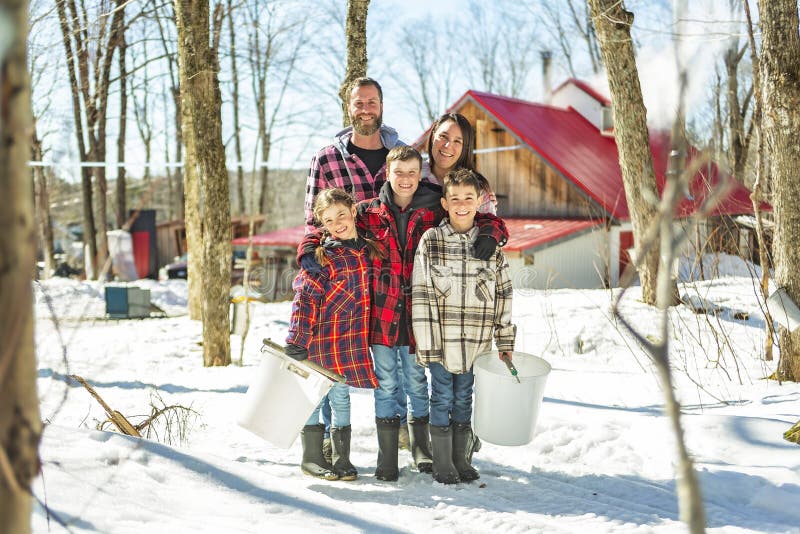 Family Close To a Maple Shack Having Fun Together Stock Photo - Image ...