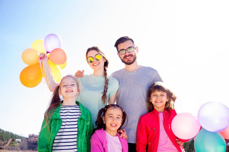 Family with Colorful Balloons Stock Image - Image of happy, cheerful ...
