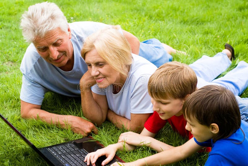 Family with computer stock image. Image of grandparents - 20699695