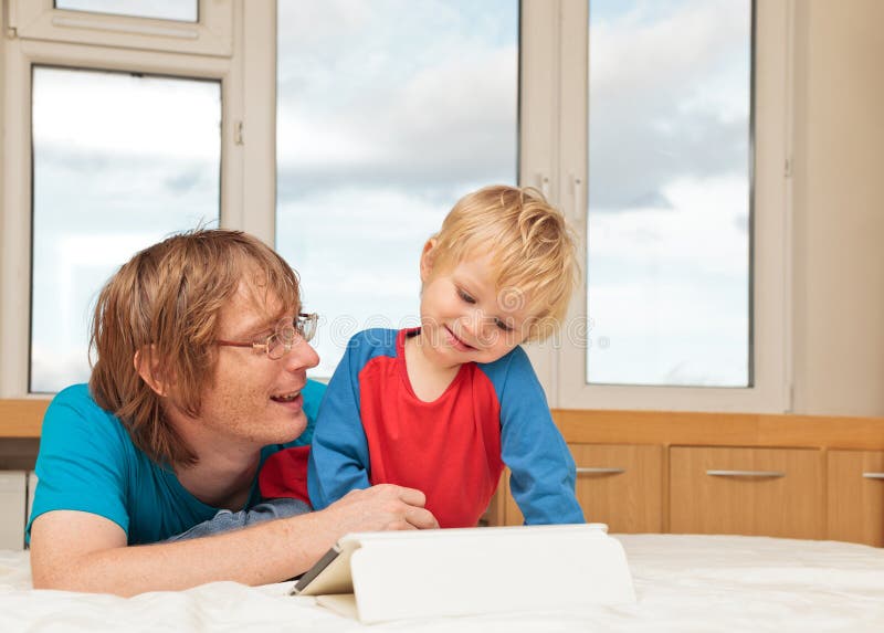 Family with Computer at Home Stock Photo - Image of childhood, laptop ...
