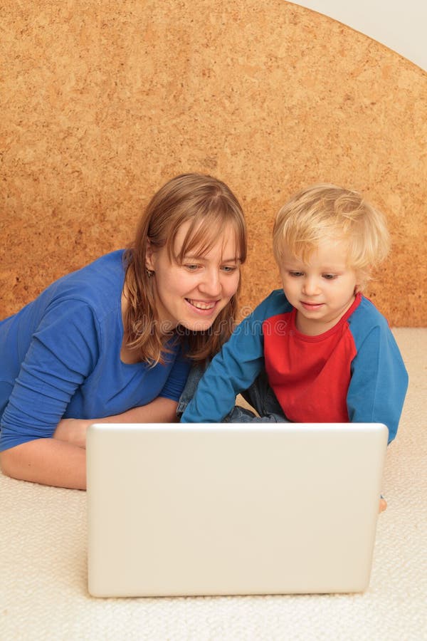 Family with Computer at Home Stock Photo - Image of people, baby: 27379394