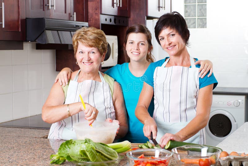 Three Generation Family in Kitchen Cooking Lunch Stock Image - Image of ...
